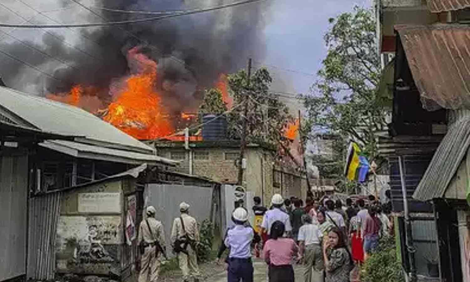 Mob, troops clash in Imphal houses set afire