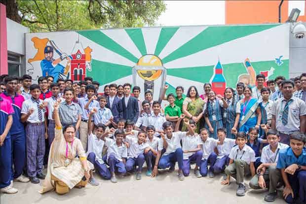 School students help create wall mural on ICC World Cup