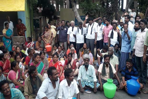 Black ribbon protest by residents in Adambakkam